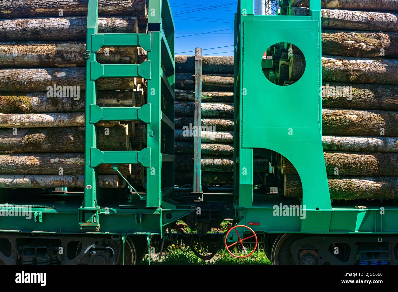 loaded railway wagons for carrying of logs close-up Stock Photo - Alamy