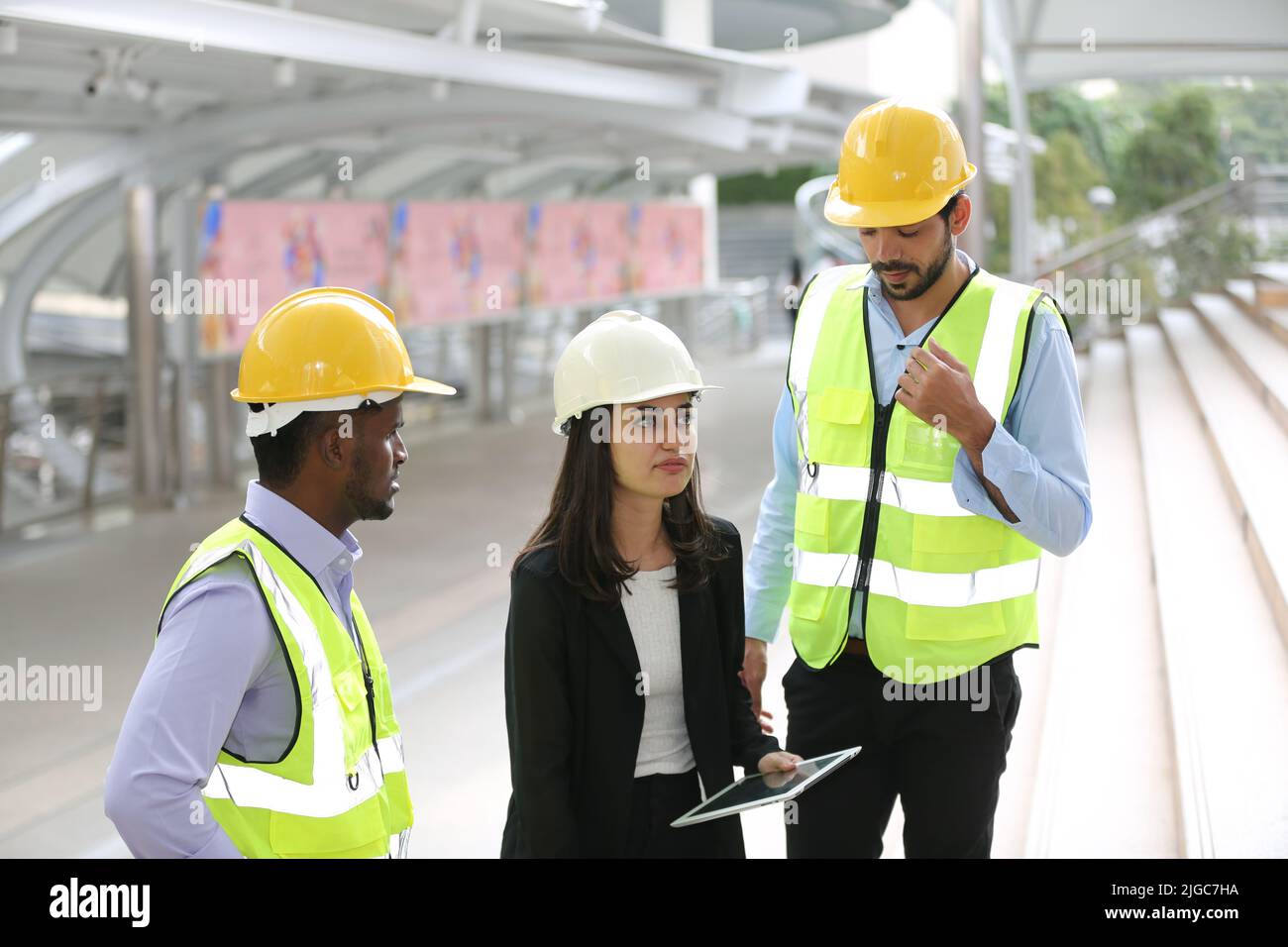 Architect, civil engineer and worker looking at plans and blueprints ...