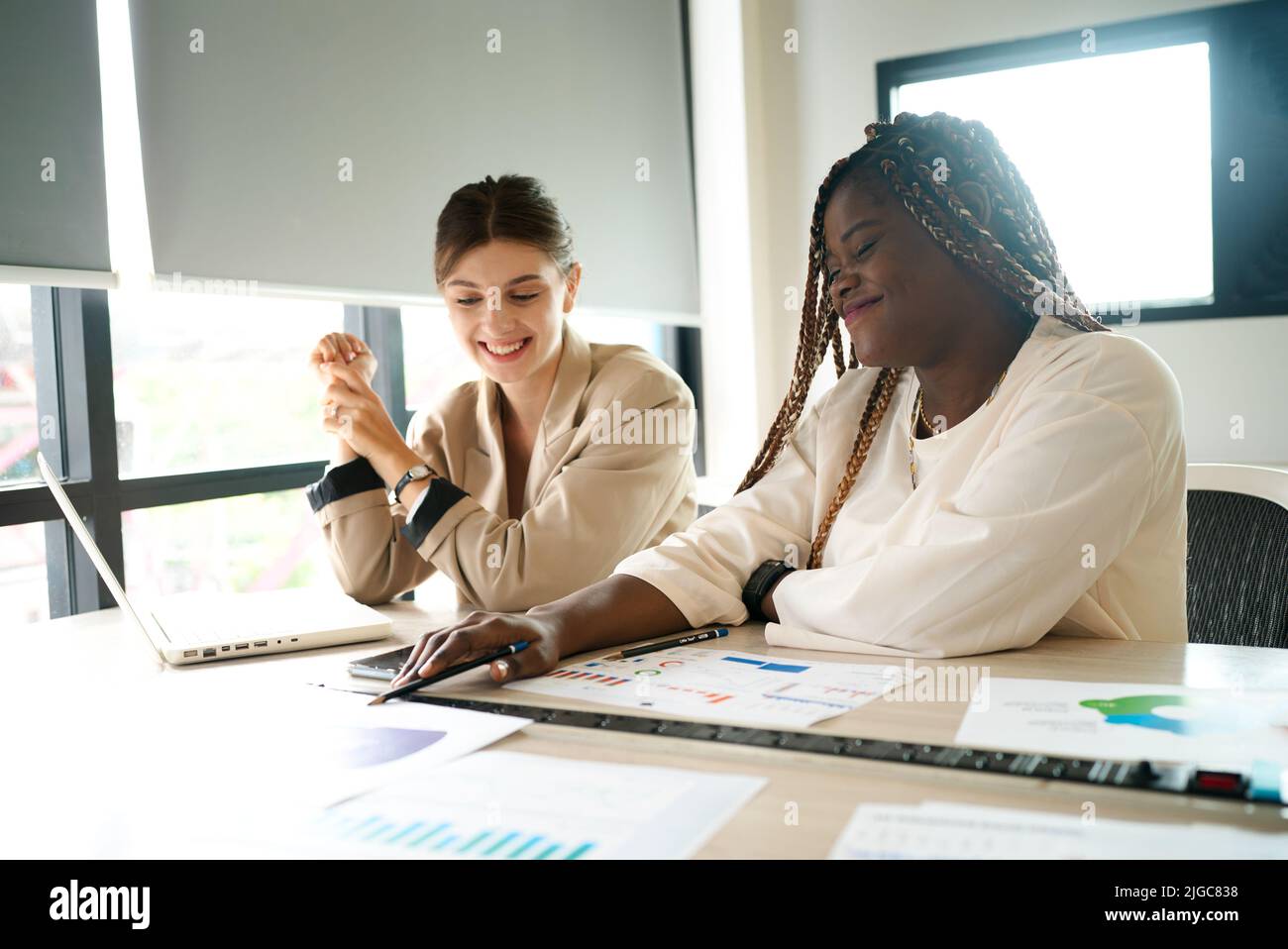 Business people discussing the charts and graphs showing the results of ...