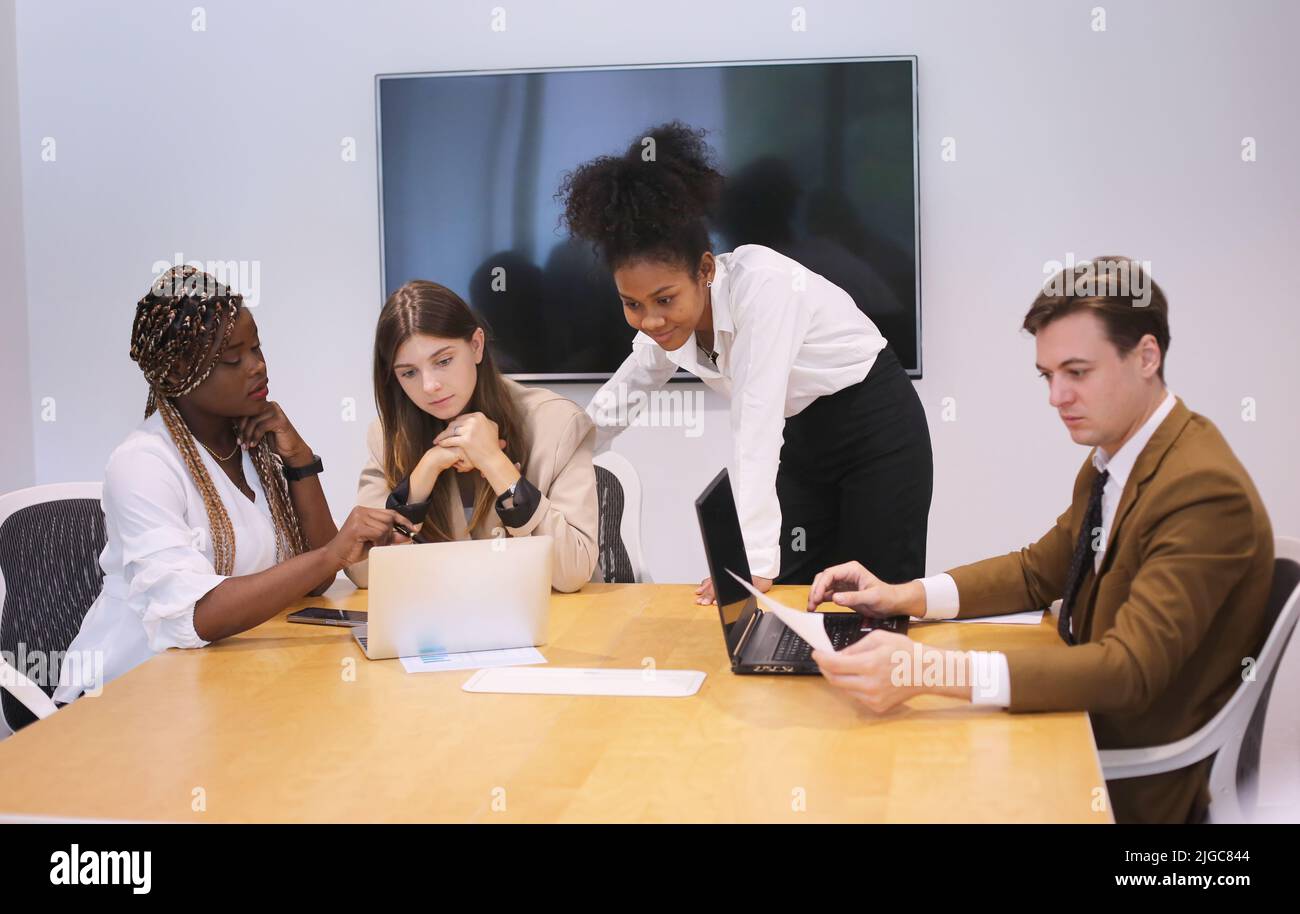 Business people discussing the charts and graphs showing the results of ...