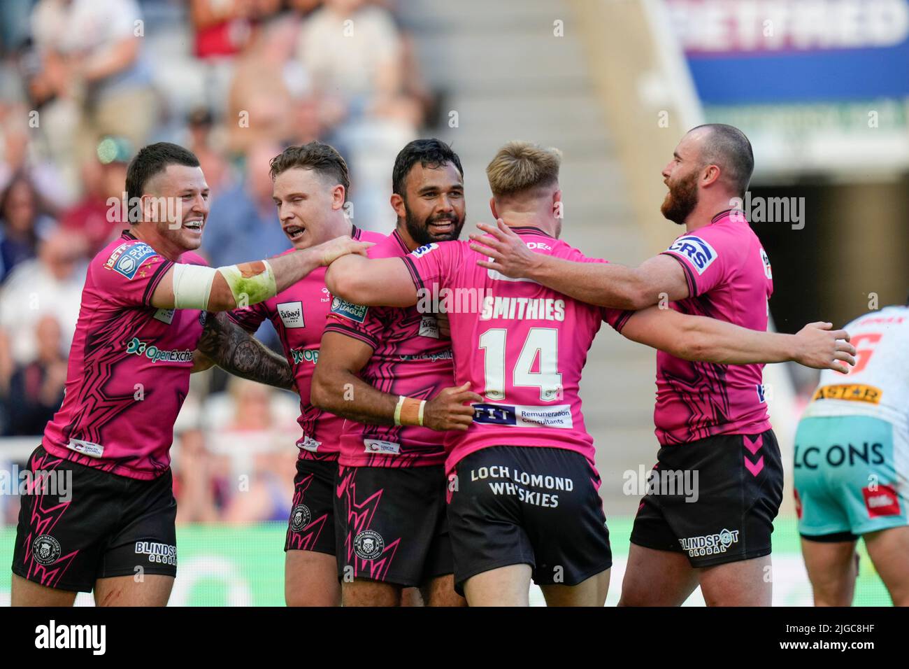 Wigan Warriors players celebrate with try scorer Bevan French Stock ...