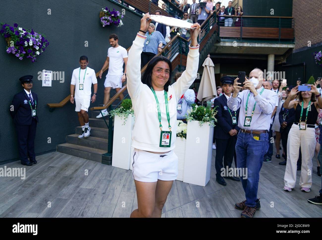 Ons Jabeur greets her supporters with the runners up trophy following ...