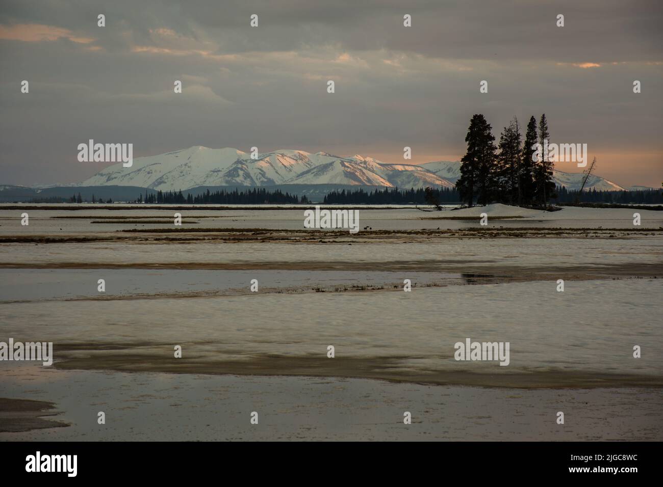 Mountains by the partially frozen Yellowstone Lake Stock Photo - Alamy