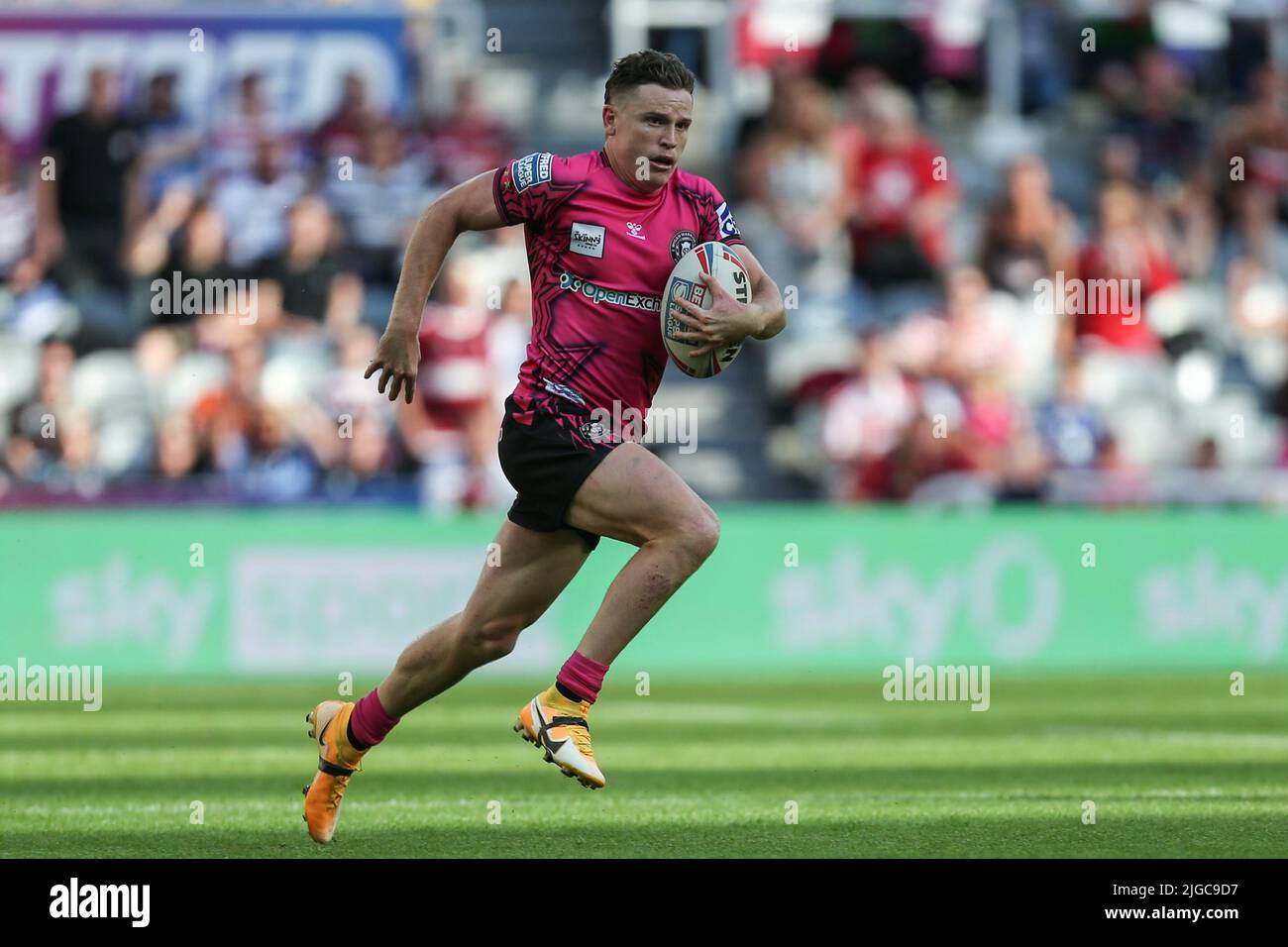 Jai Field #23 of Wigan Warriors runs with the ball Stock Photo - Alamy