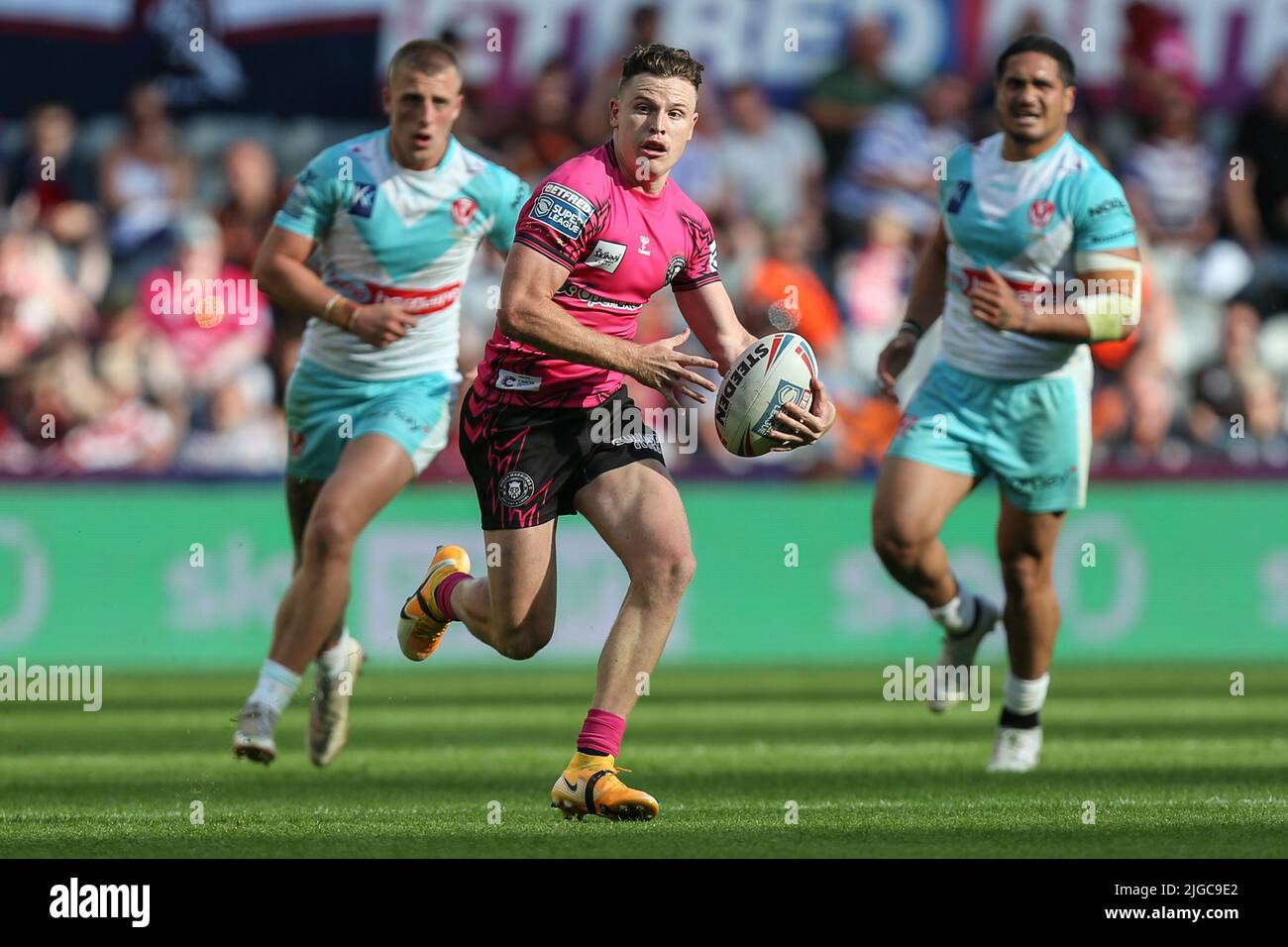 Jai Field #23 of Wigan Warriors runs with the ball Stock Photo - Alamy