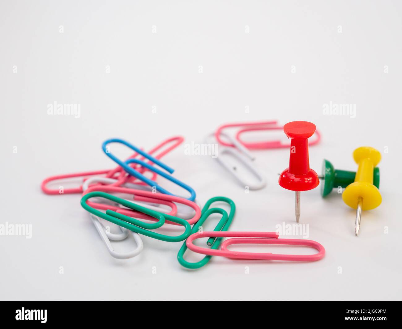 Set of colored paper clips and thumbtacks. Buttons and paperclips Stock ...
