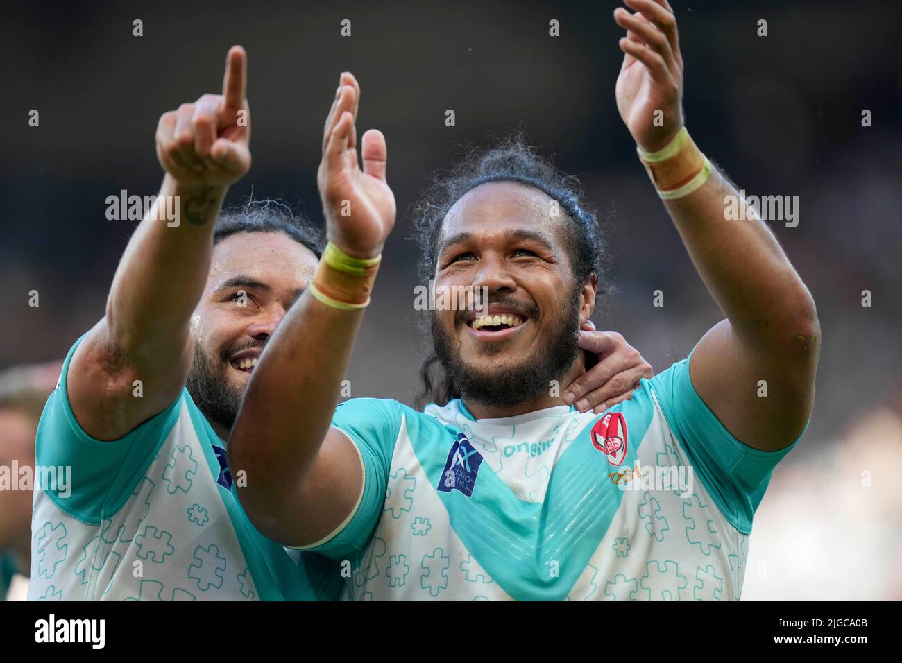 Agnatius Paasi #17 and Konrad Hurrell #23 of St Helens celebrates with ...