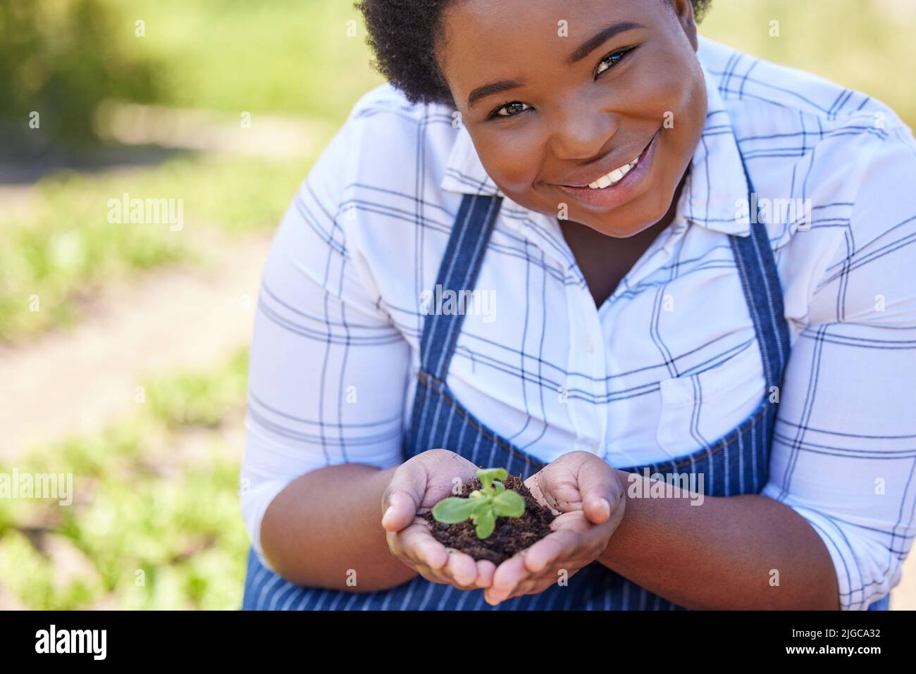 Anything can become beautiful with good care. a young woman holding a ...