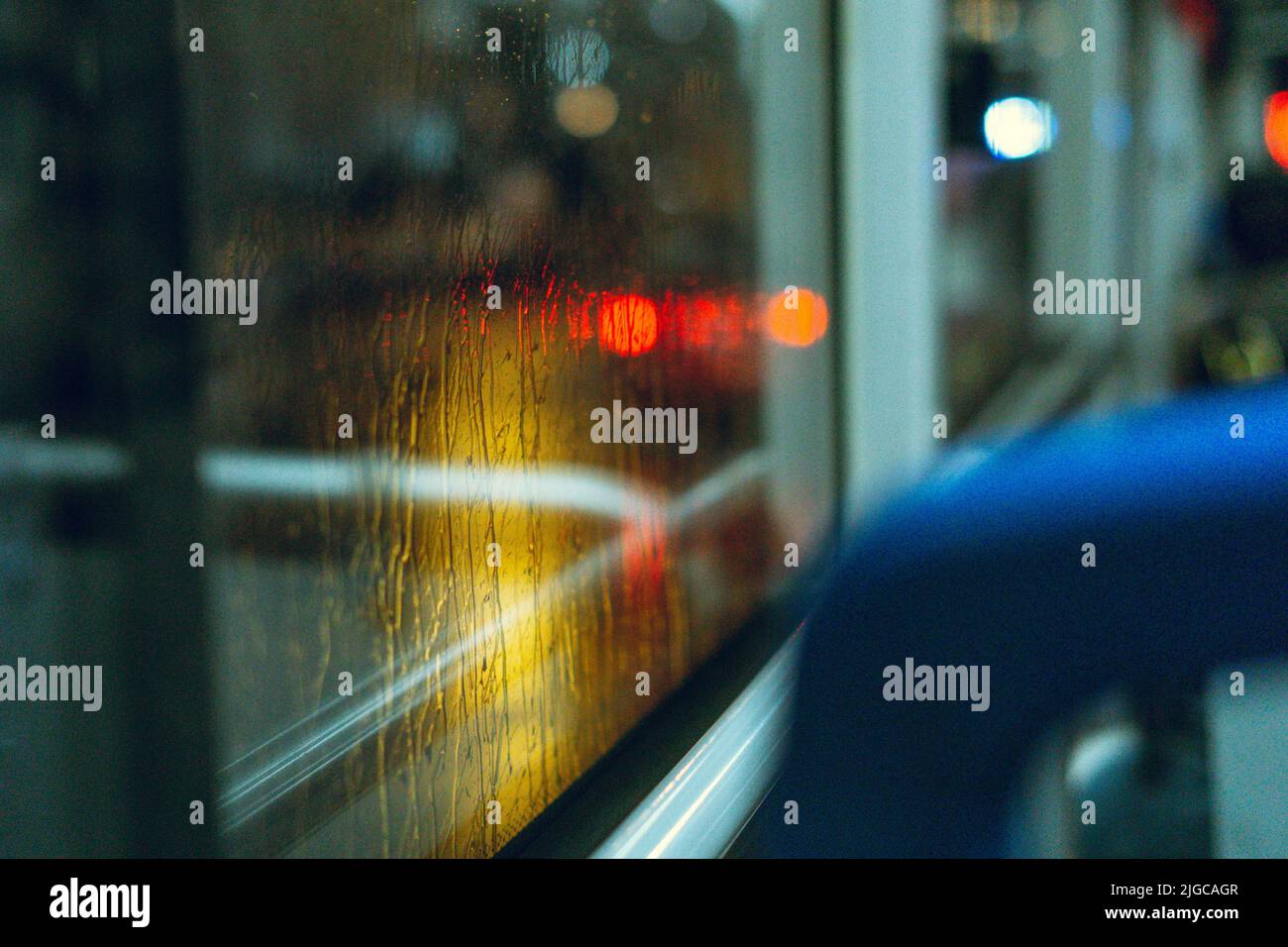 An inside of a bus with a view of a window and raindrops Stock Photo ...