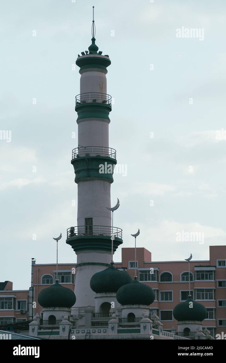 A vertical shot of the Harbin Daowai Mosque tower in China Stock Photo ...