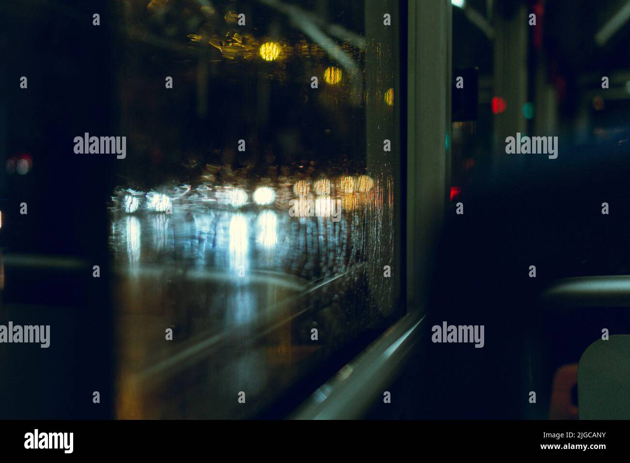 An inside of a bus with a view of a window and raindrops Stock Photo ...