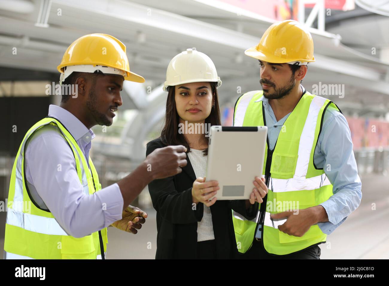 Architect, civil engineer and worker looking at plans and blueprints ...
