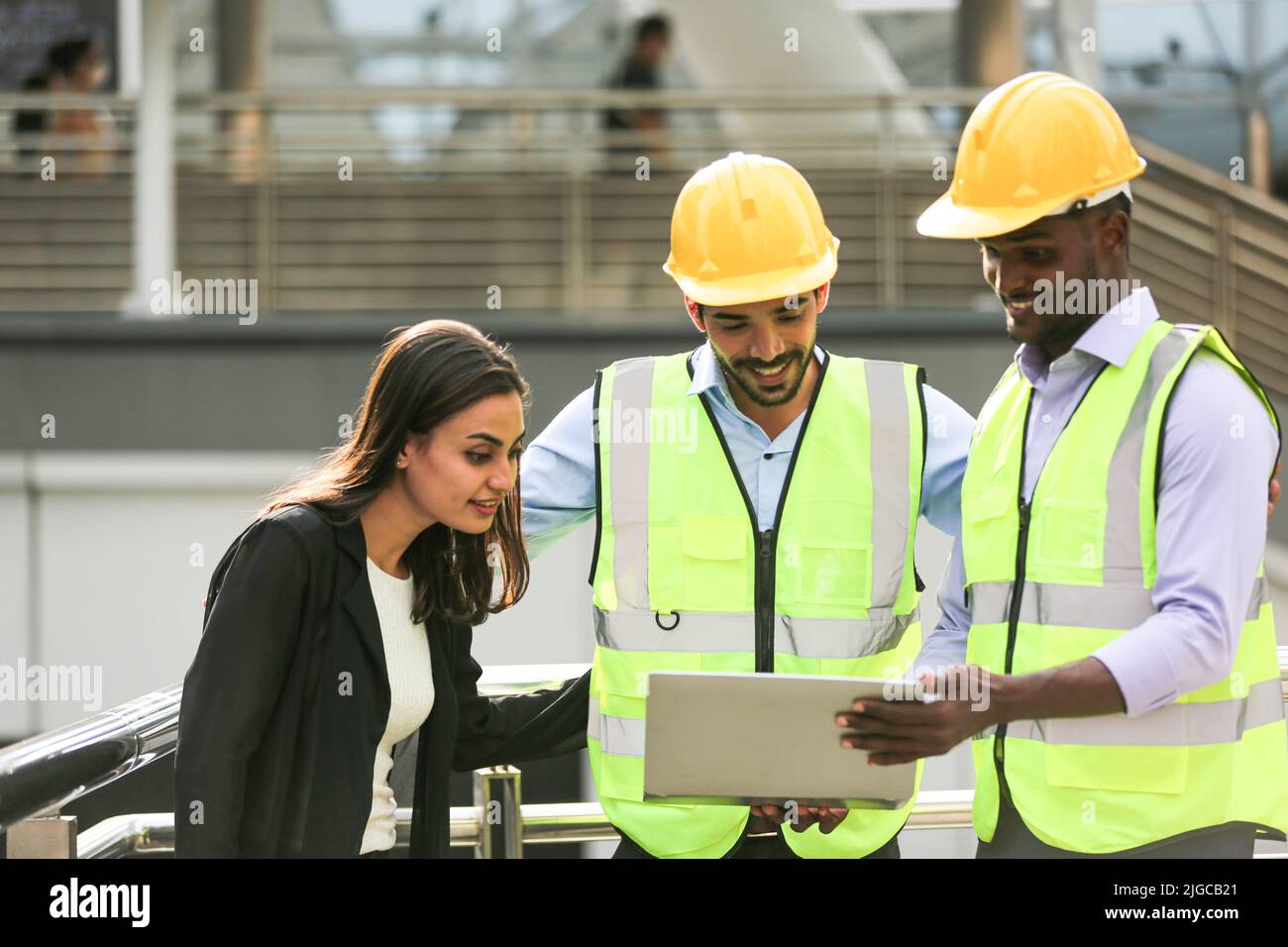 Architect, civil engineer and worker looking at plans and blueprints ...