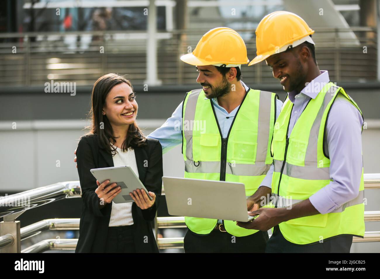 Architect, civil engineer and worker looking at plans and blueprints ...