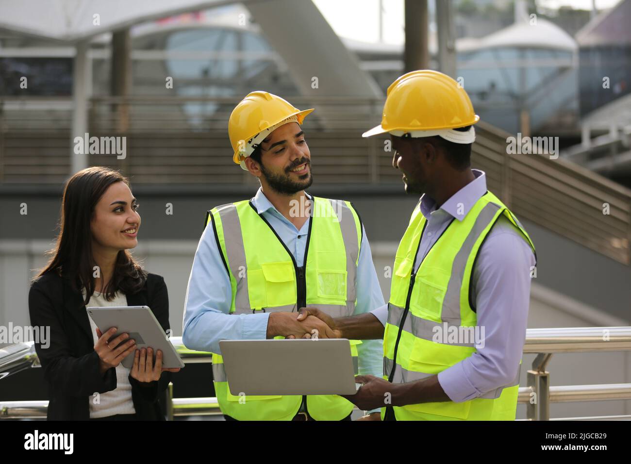 Architect, civil engineer and worker looking at plans and blueprints ...