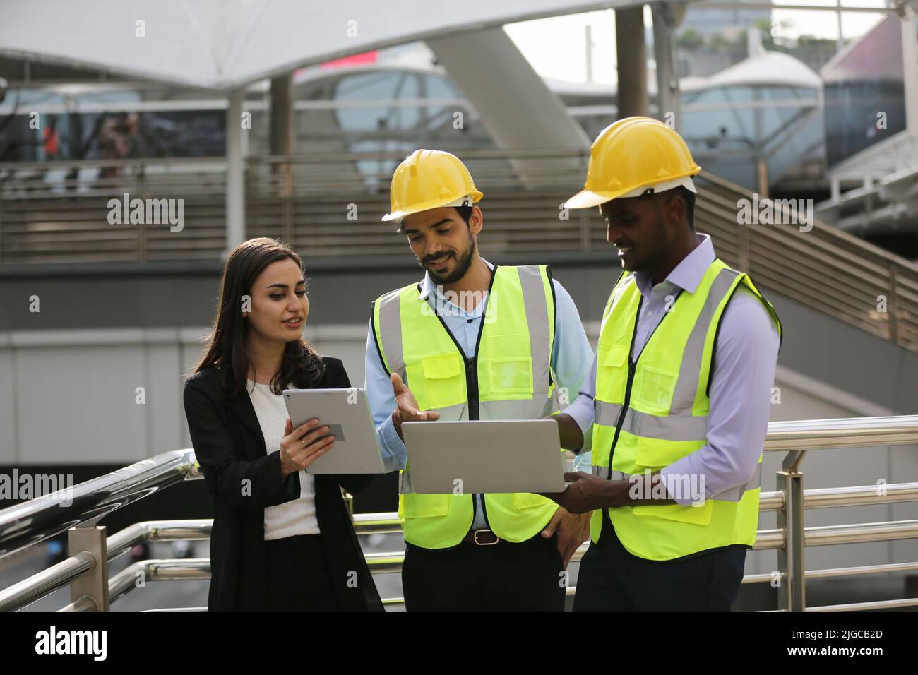 Architect, civil engineer and worker looking at plans and blueprints ...