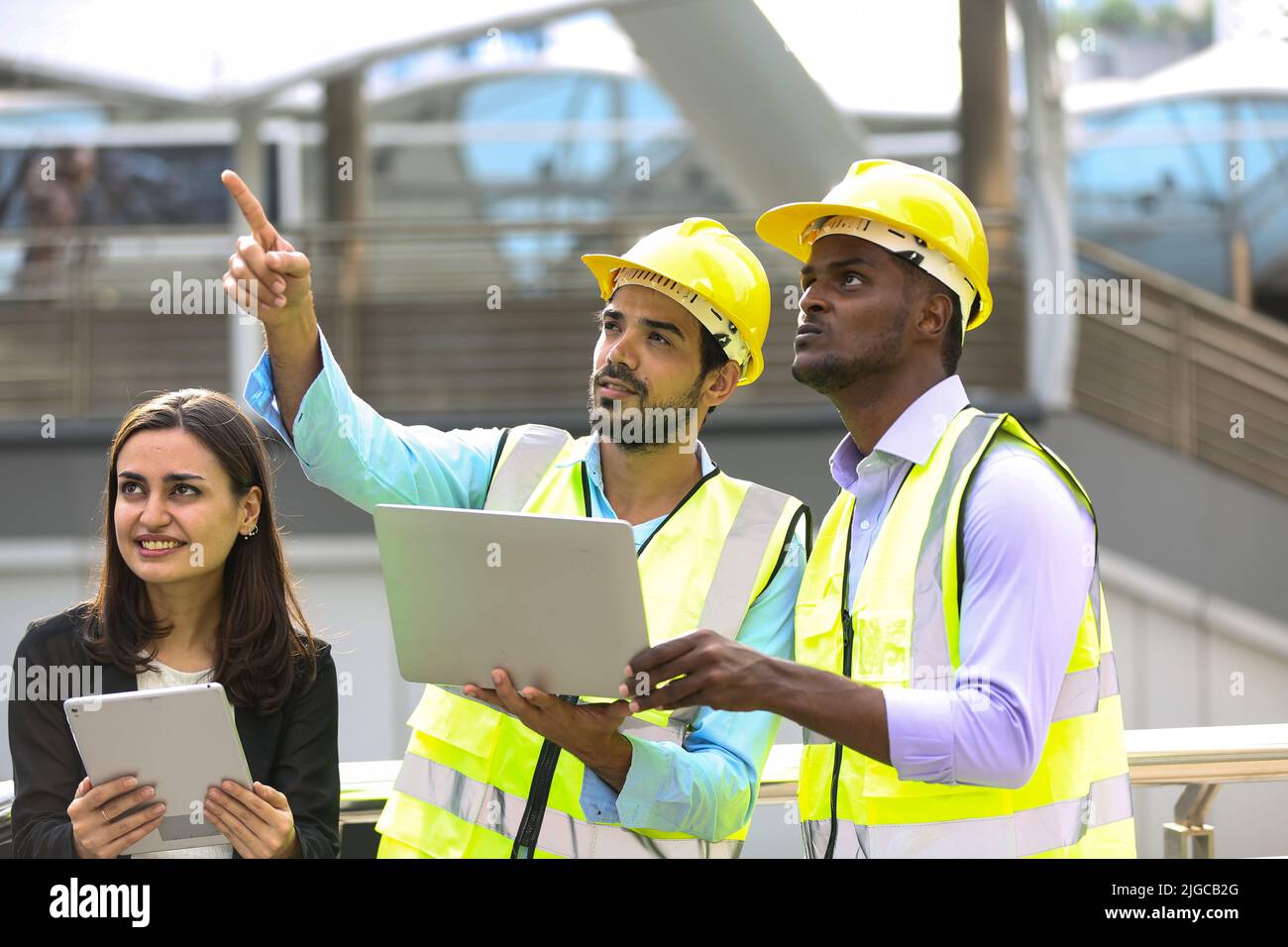 Architect, civil engineer and worker looking at plans and blueprints ...