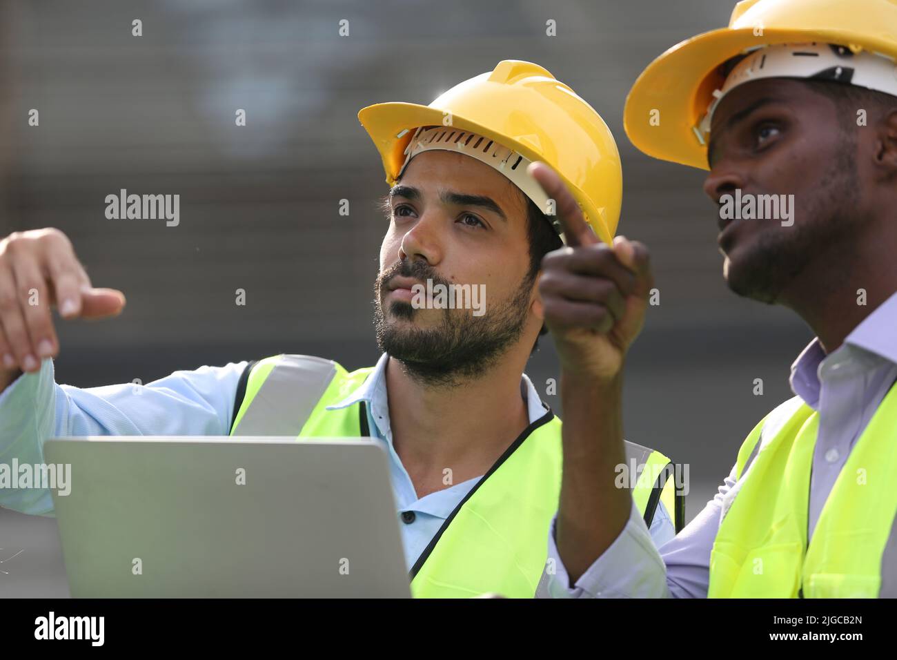 Architect, civil engineer and worker looking at plans and blueprints ...