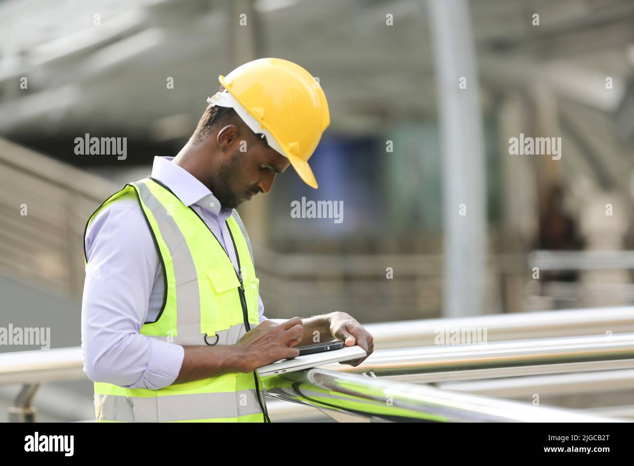 Architect, civil engineer and worker looking at plans and blueprints ...