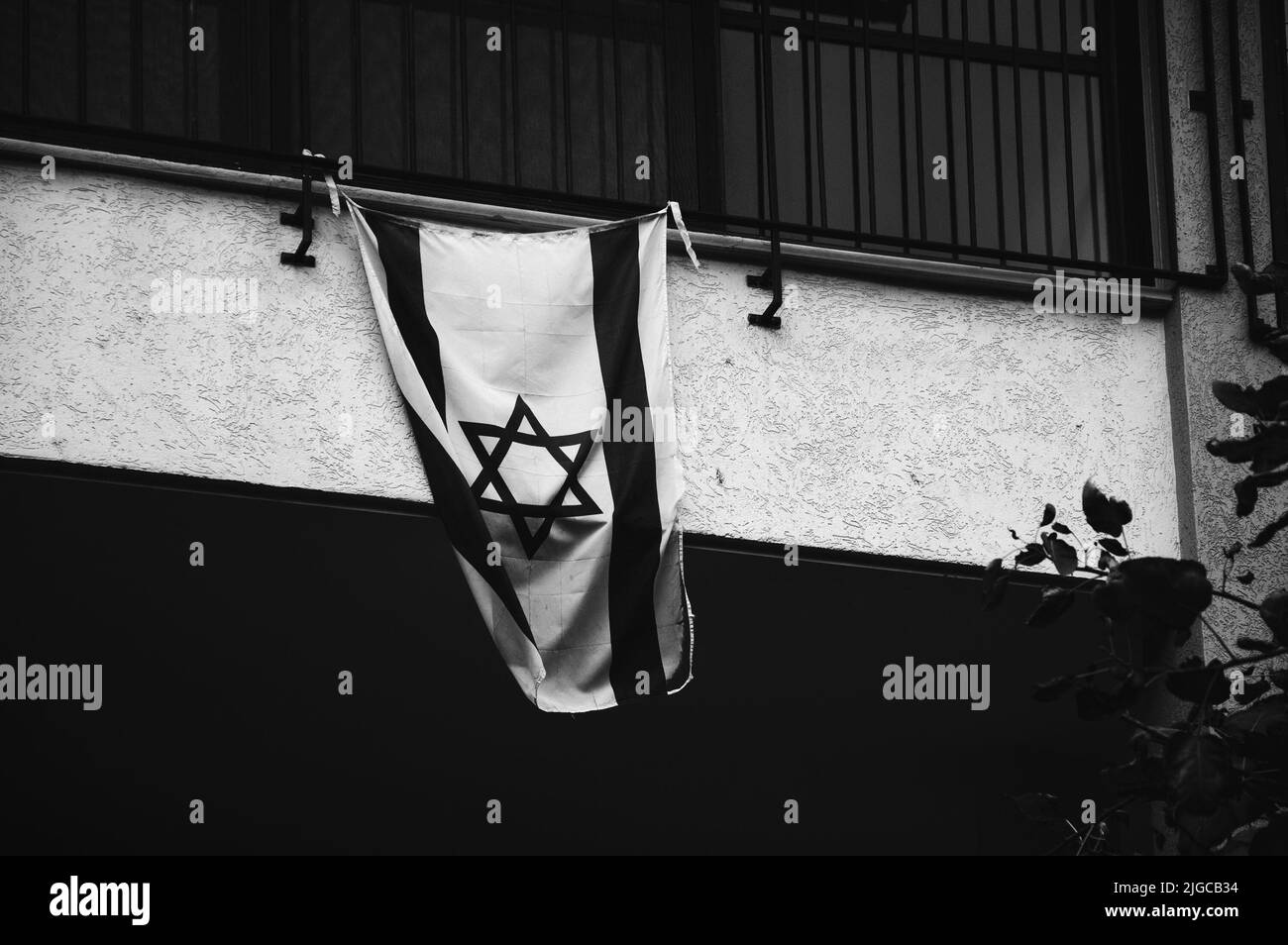 Israeli flag hanging on typical building in Tel Aviv, Israel. Black ...