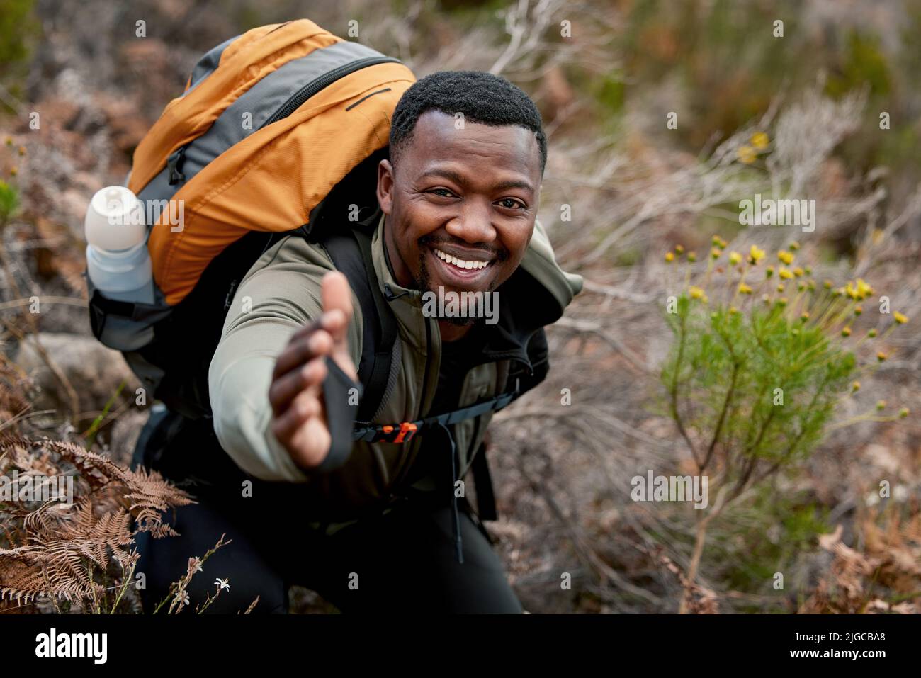 A helping hand. Cropped portrait of a handsome young male hiker ...