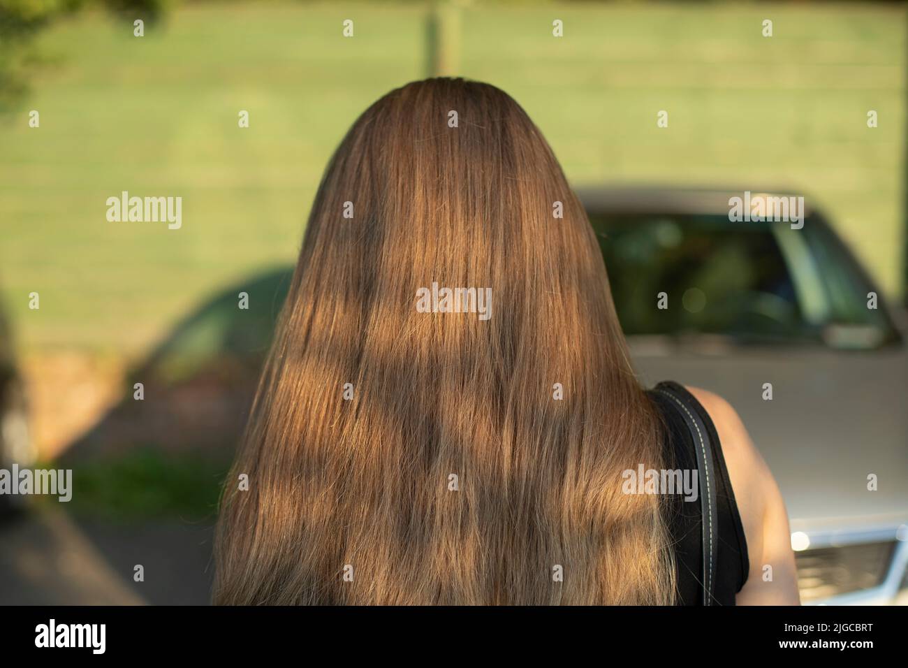 Girl's hair. Woman has long hairstyle. Hair styling details. Man from ...