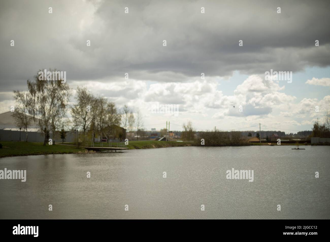 Lake in rainy weather. Pond in woods. Countryside. Landscape with ...