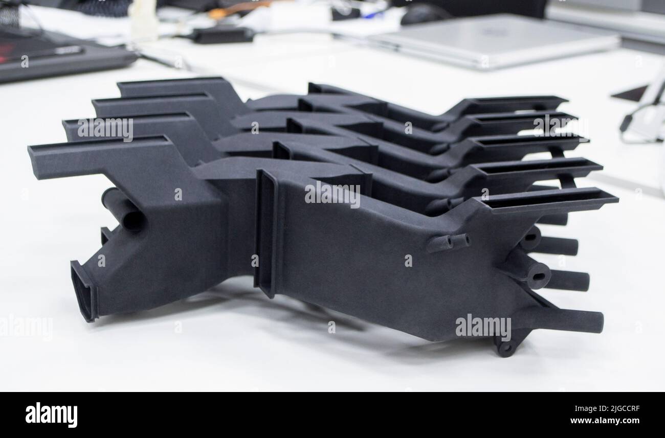 Black model printed on 3D printer in laboratory office. Object printed ...
