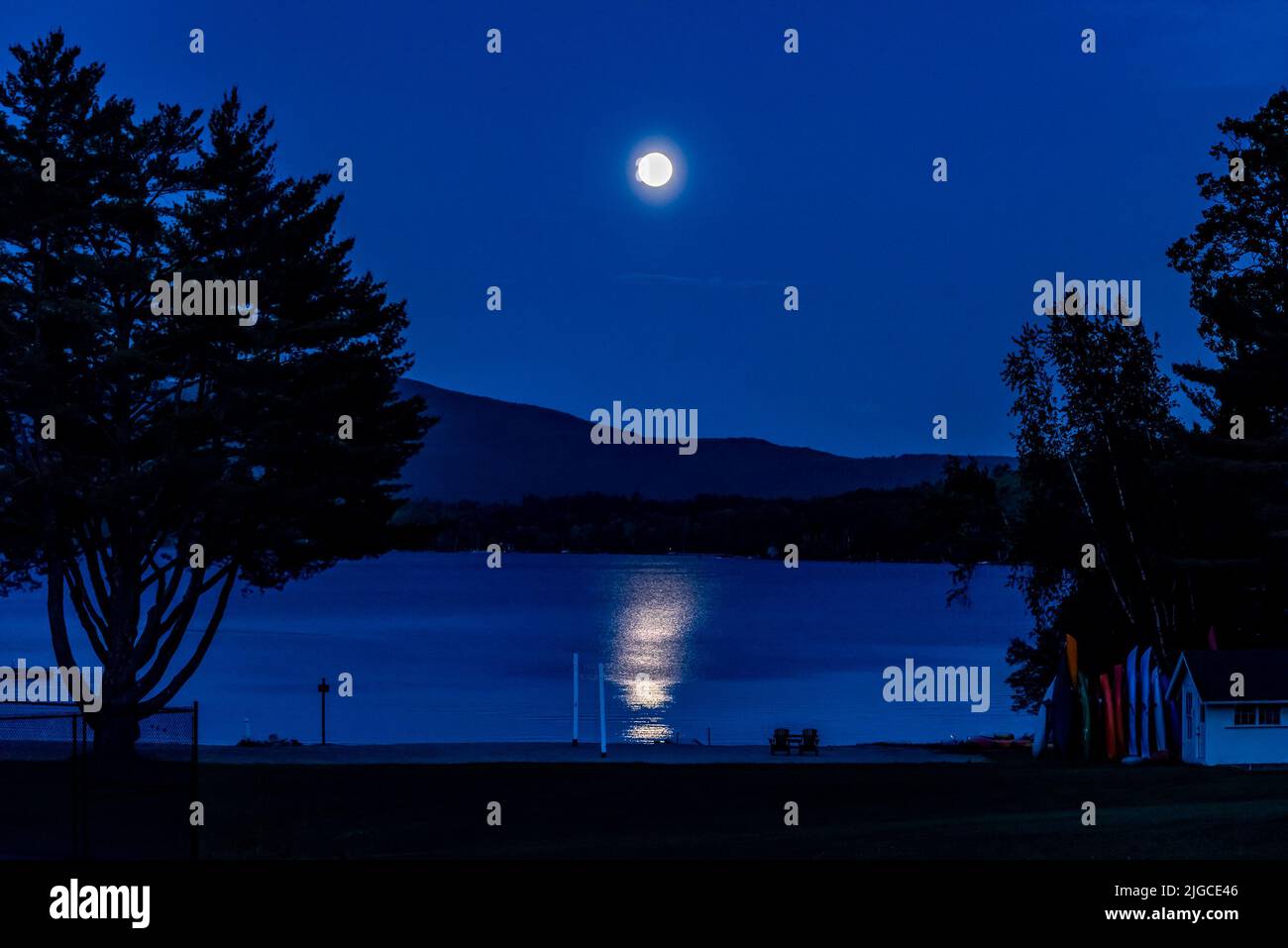 Full moon rising over Mt. Kersarge, Pleasant Lake, New London, NH. Site ...