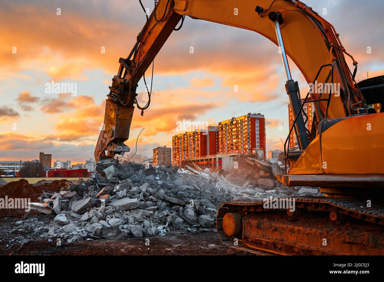 Excavator with concrete crusher on rig at demolition site Stock Photo ...