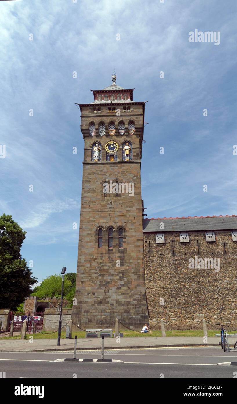 Cardiff Castle clock tower against a blue sky and light cloud ...