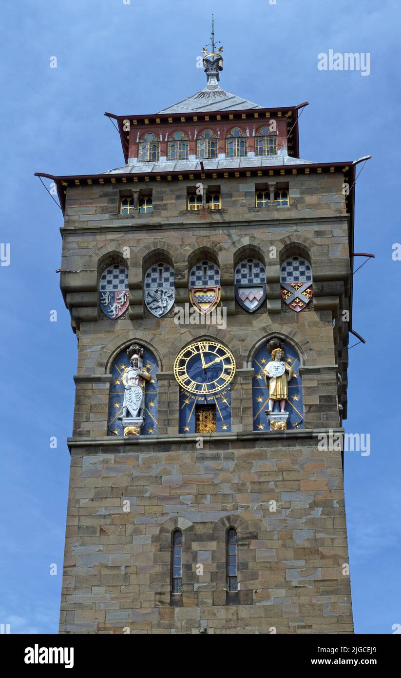 Cardiff Castle clock tower against a blue sky and light cloud ...