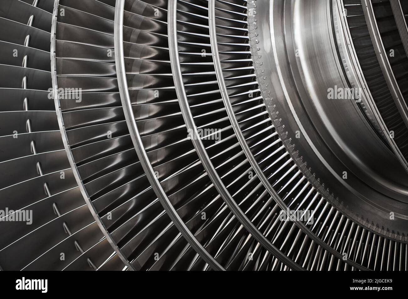 Metal blades of high-speed steam turbine in light workshop Stock Photo ...