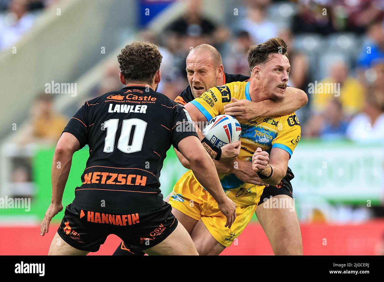Liam Watts #8 of Castleford Tigers tackles James Donaldson #25 of Leeds Rhinos in Newcastle ...