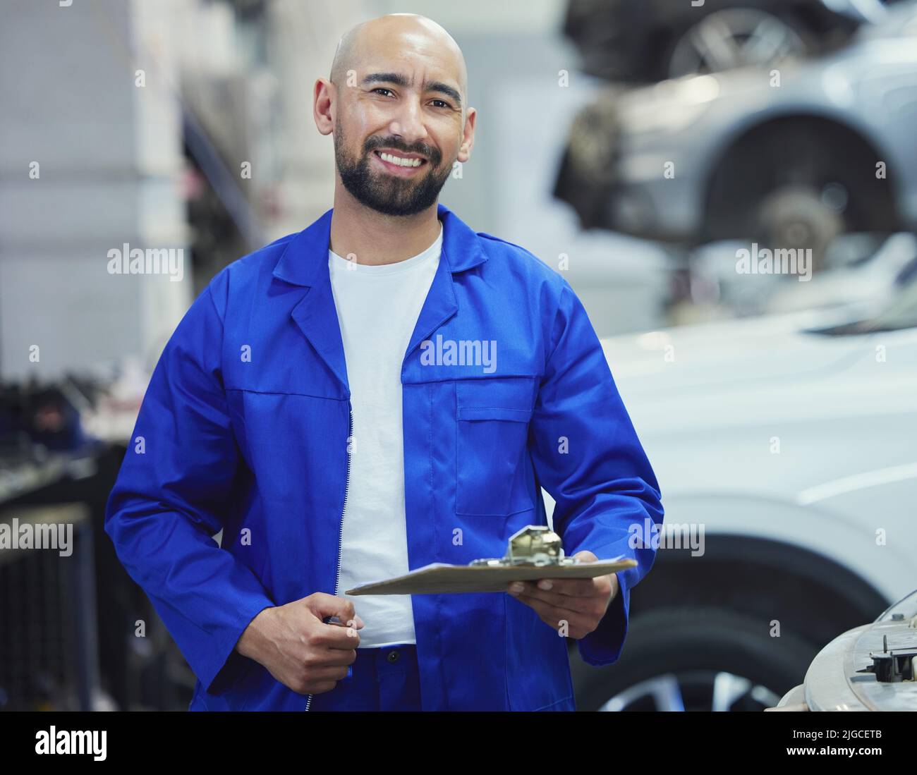 Lets assess your vehicle. Cropped portrait of a handsome young male ...