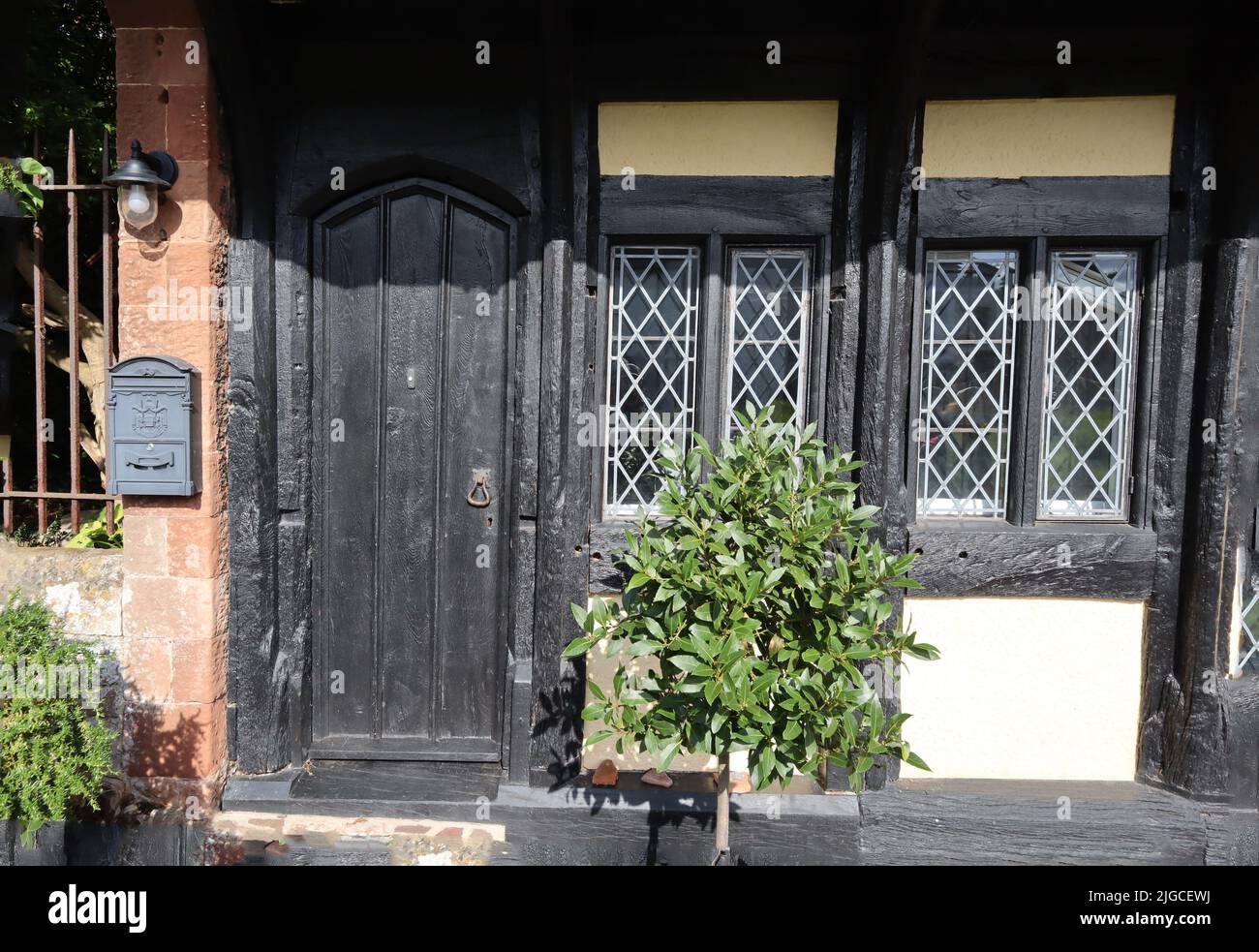 Close up of the door and window of the priest's house which is next to ...
