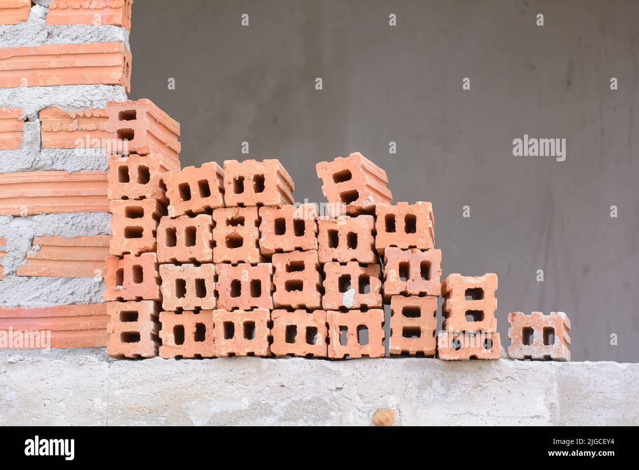 The brick stones against the gray texture - construction background ...