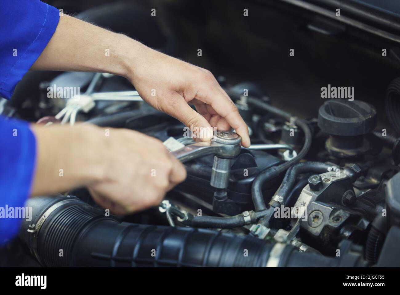 Getting to grips with your engine. High angle shot of an unrecognizable ...