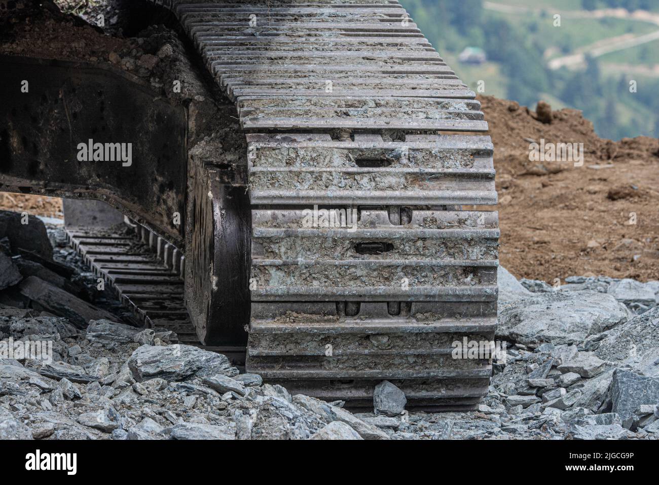 Close up detail with chain tracks of a bulldozer on a demolition site ...
