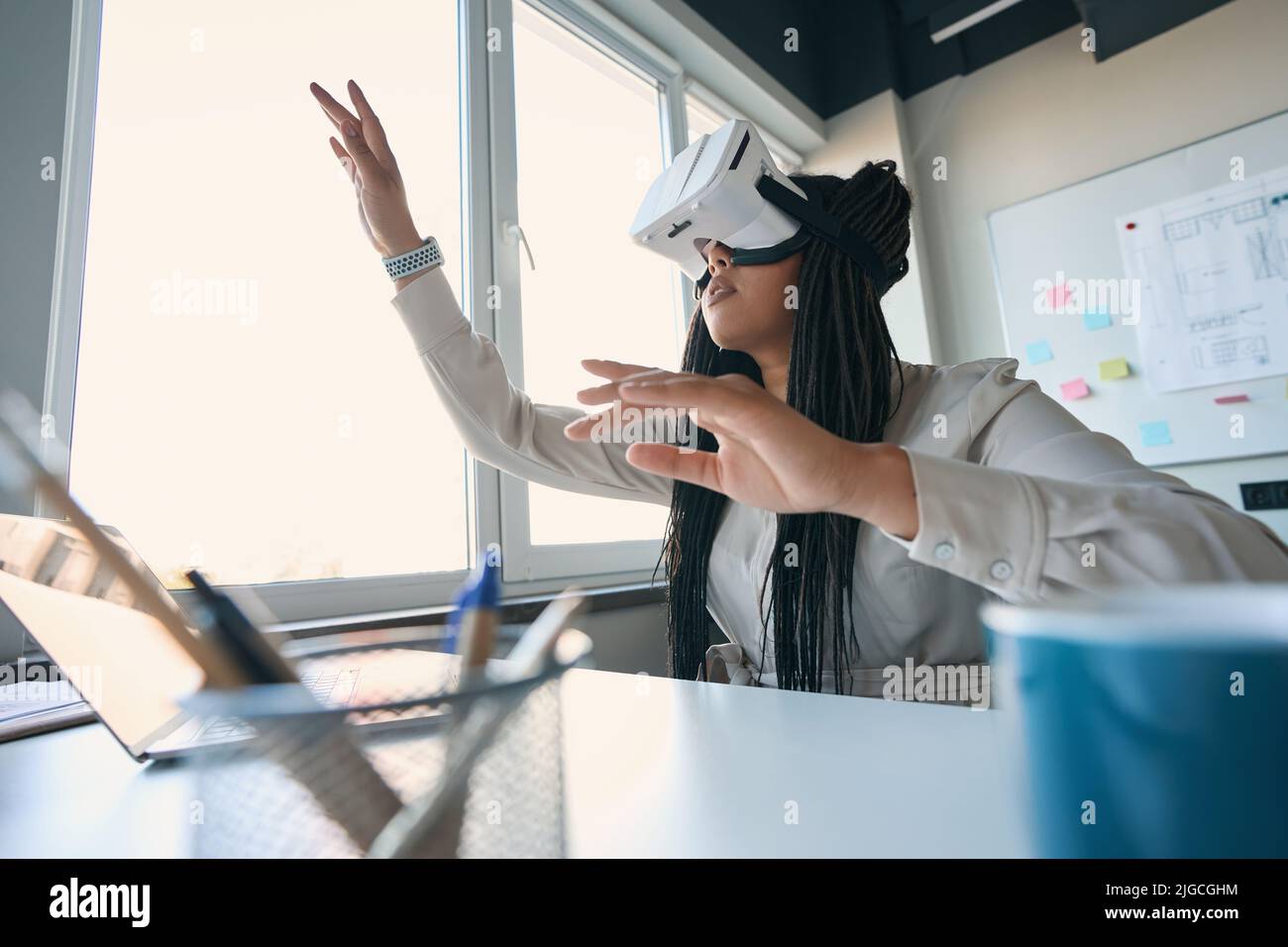 Corporate employee implementing new technology in workplace Stock Photo ...