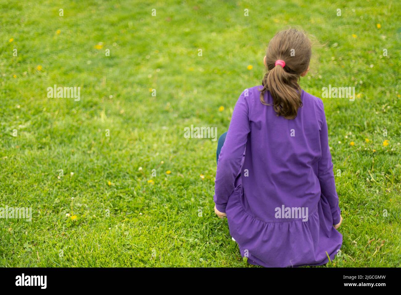 Child on green grass. Schoolboy plays on lawn in summer. Active ...