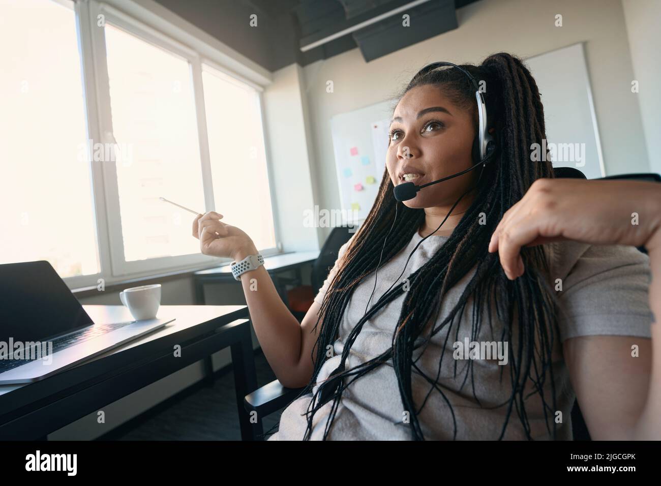 Lady in headphones microphone hi-res stock photography and images - Alamy
