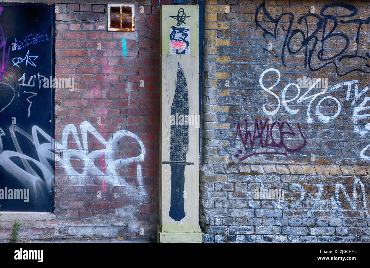 Street art of a knife and more with graffiti sprays. Waterloo, London ...