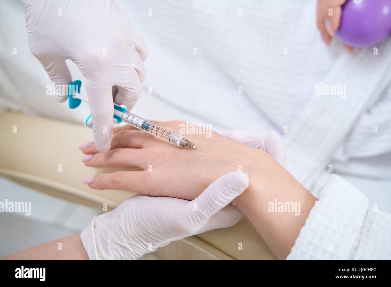 Close up of injections in the arm against aging in the medical center ...
