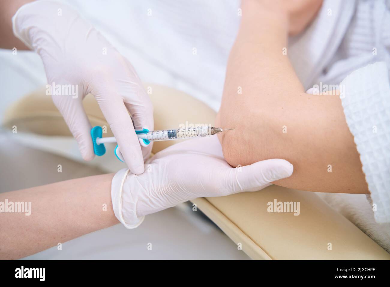 Close up of injection in the elbow for lady Stock Photo - Alamy