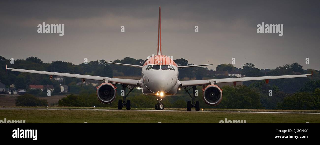 A panoramic shot of an Easyjet plane on a runway preparing to take off ...