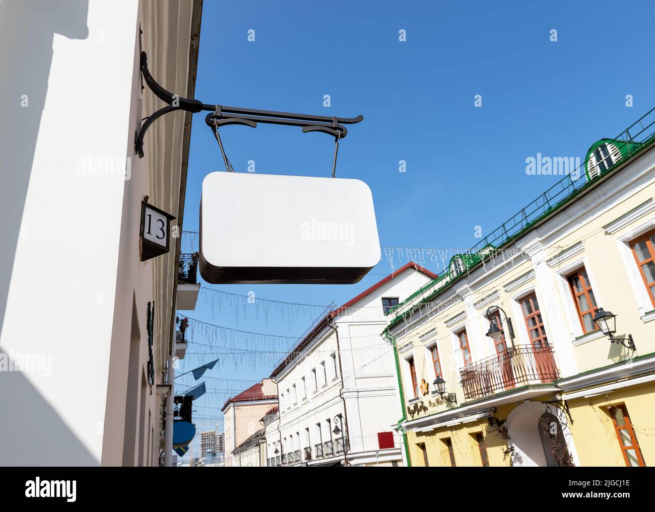 Old city signboard mockup. Beautiful downtown in sunshine with vintage ...