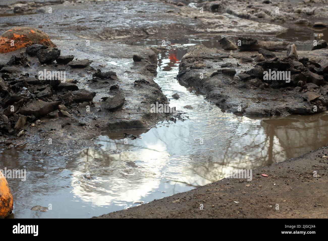 Dirt on road. Road is in muddy snow. Details of urban environment in ...