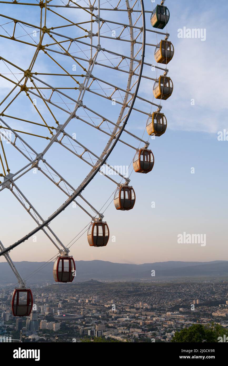 Ferris wheel in Mtatsminda amusement park in Tbilisi, Georgia. Giant ...