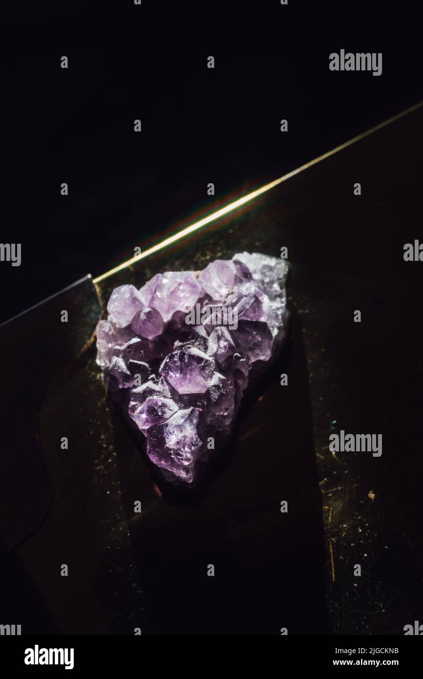 purple amethyst crystal formation with dark black background Stock ...